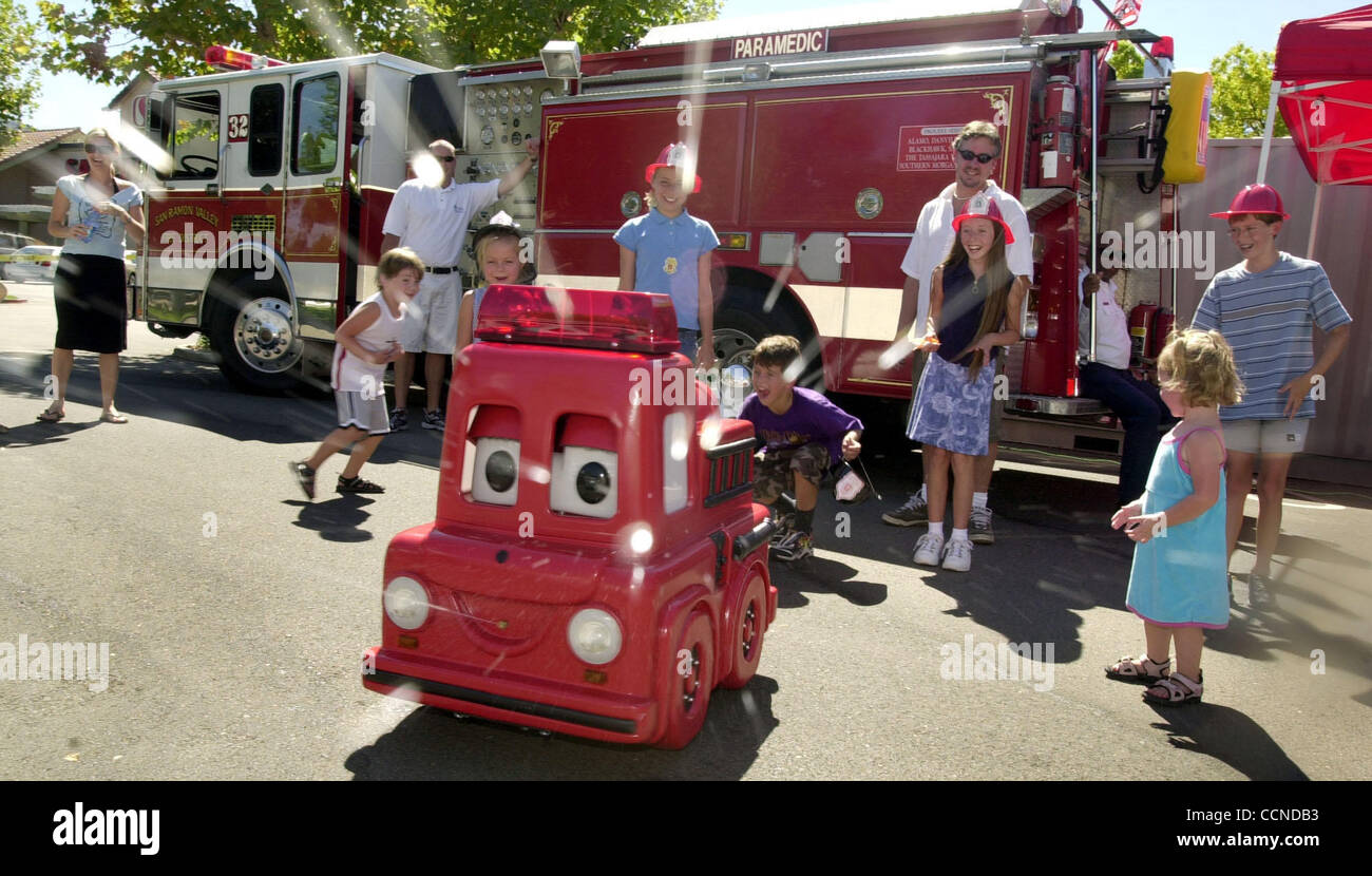 "Freddie the Fire Truck" entertains children and adults as it sprays ...