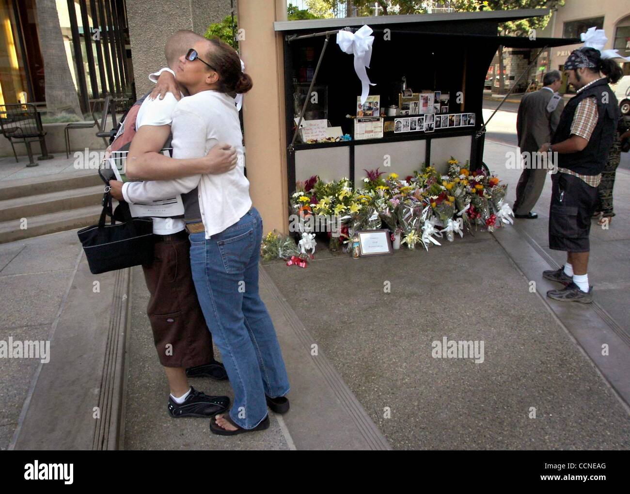 (Published 9/30/2004, B-5) Brian McNeal, left, hugged Ghia Larkins of ...