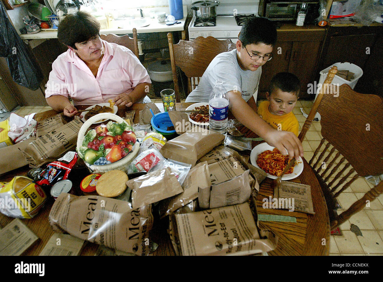 STUART - Yolanda Lozano, a married mother of four children, watches as ...