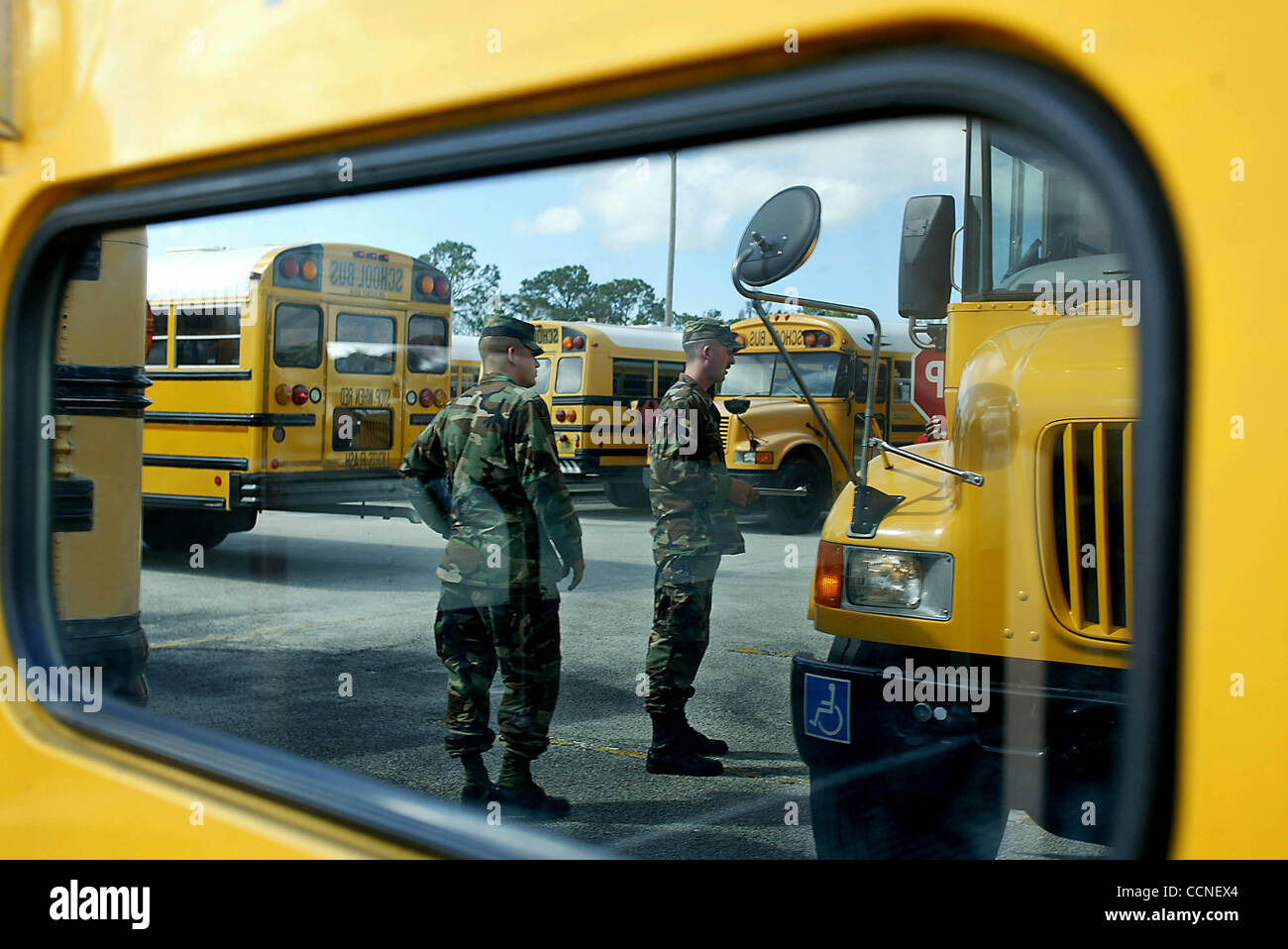 100304-Fort Pierce-National Guardsmen Specs. William Booher, cq, left ...