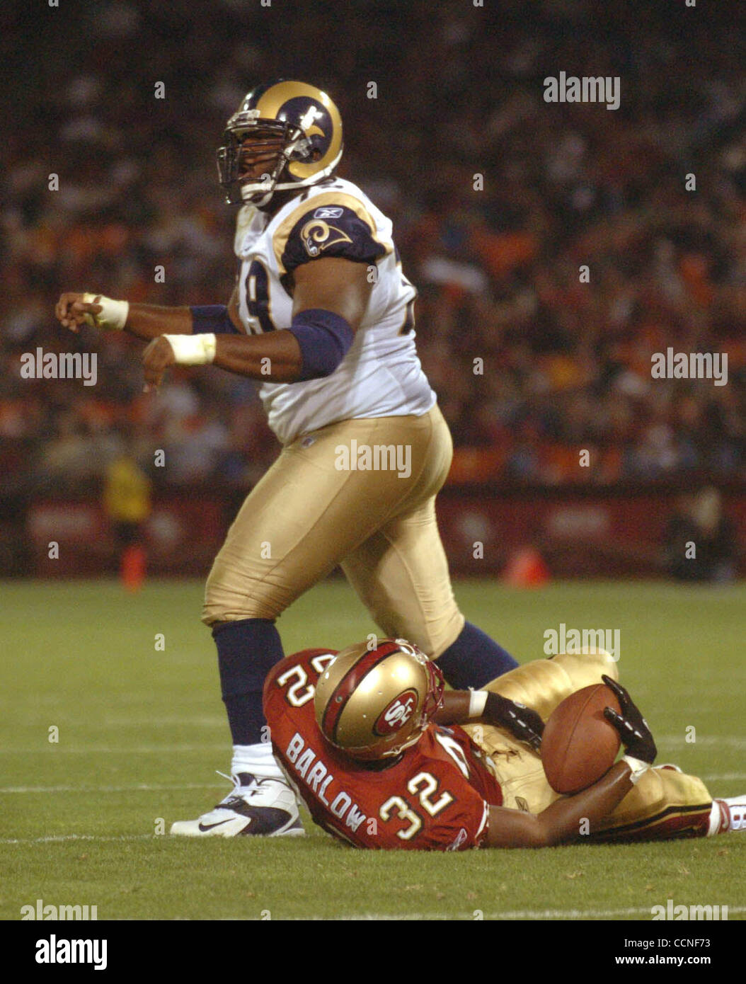 San Francisco Forty Niner running back Kevan Barlow is stopped by St ...