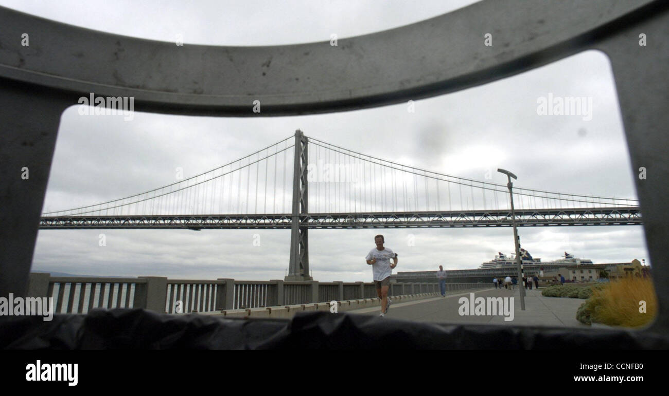 The western span of the Bay Bridge seen through a trash bin opening in ...