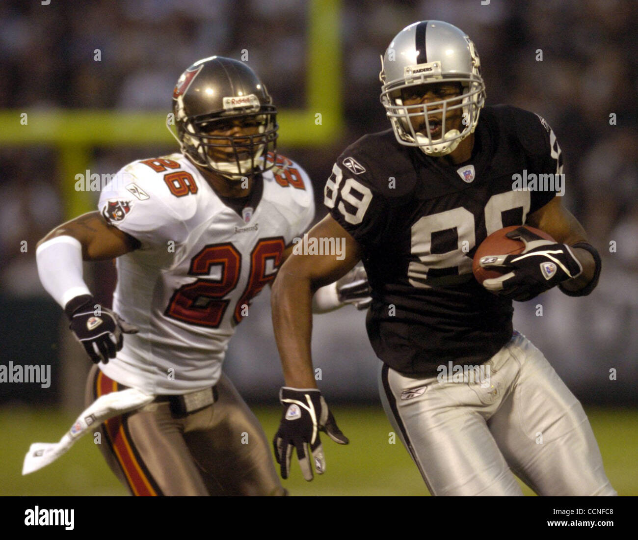 Oakland Raider receiver Ronald Curry runs toward the end zone and a TD ...