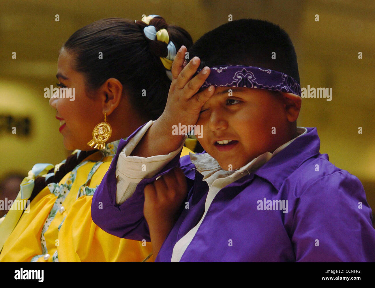 Sammy Gonzalez, age 8, from Antioch, adjusts his bandana as Christina ...