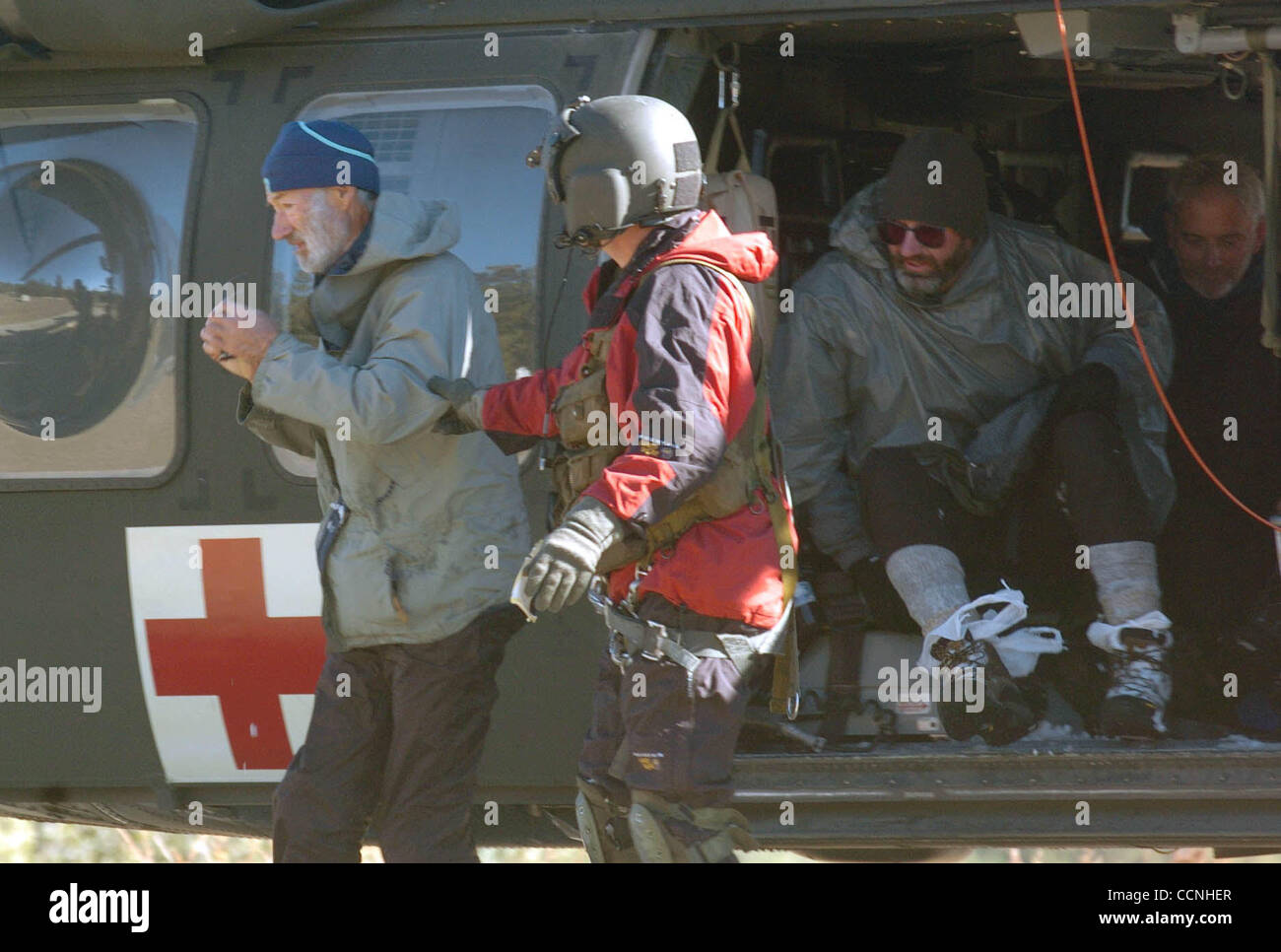 California Army National Guard helps Tom Peacock from the helicopter as ...