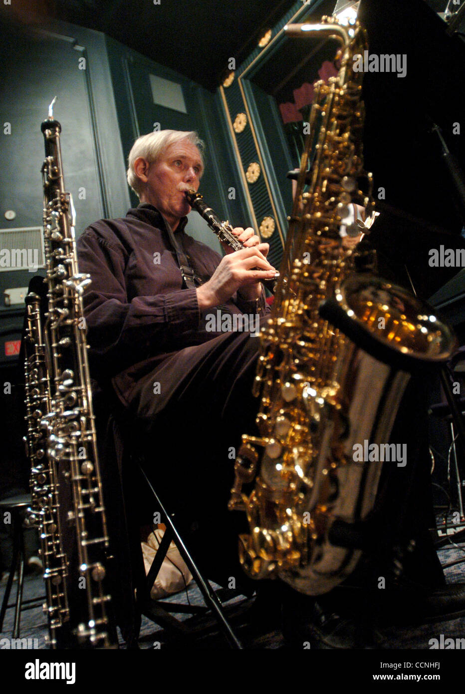 1913--Reed player Ron Kerst sets up his instruments before the dress ...