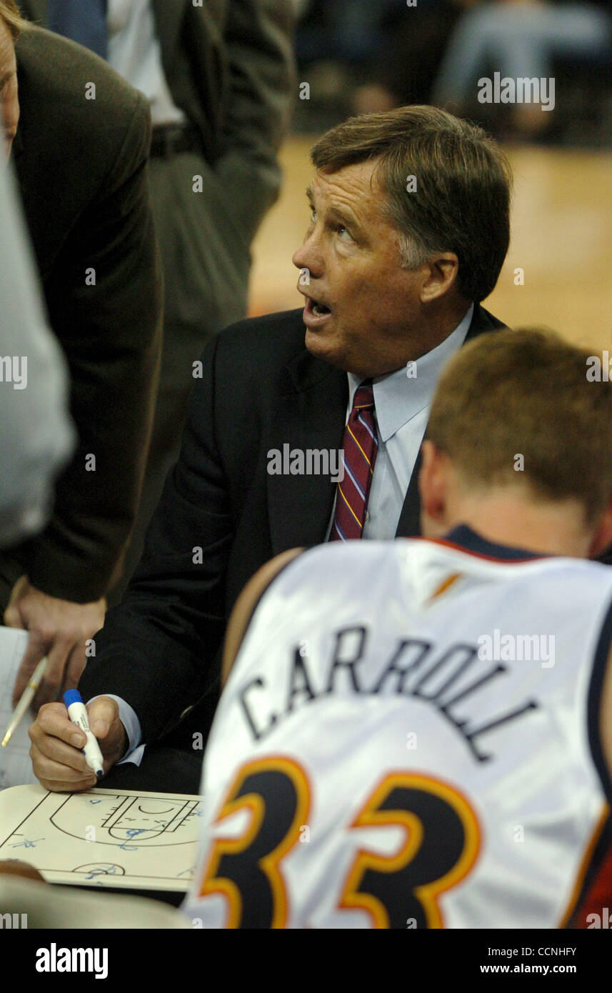 Warriors head coach Mike Montgomery sketches a play during a time out ...