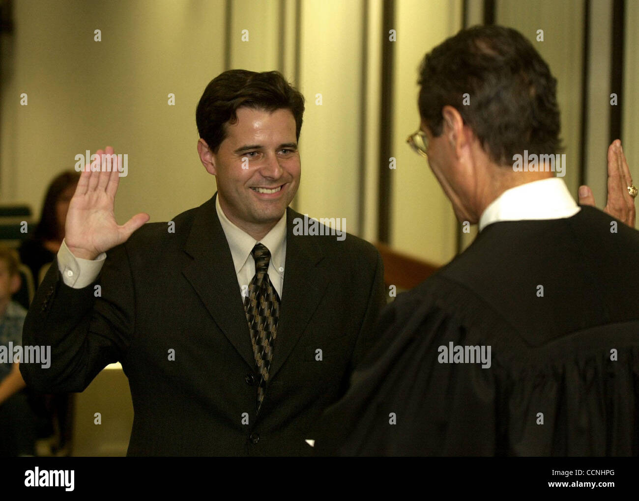 Nelson Fialho (left) is sworn in by Alameda County Superior Court Judge ...