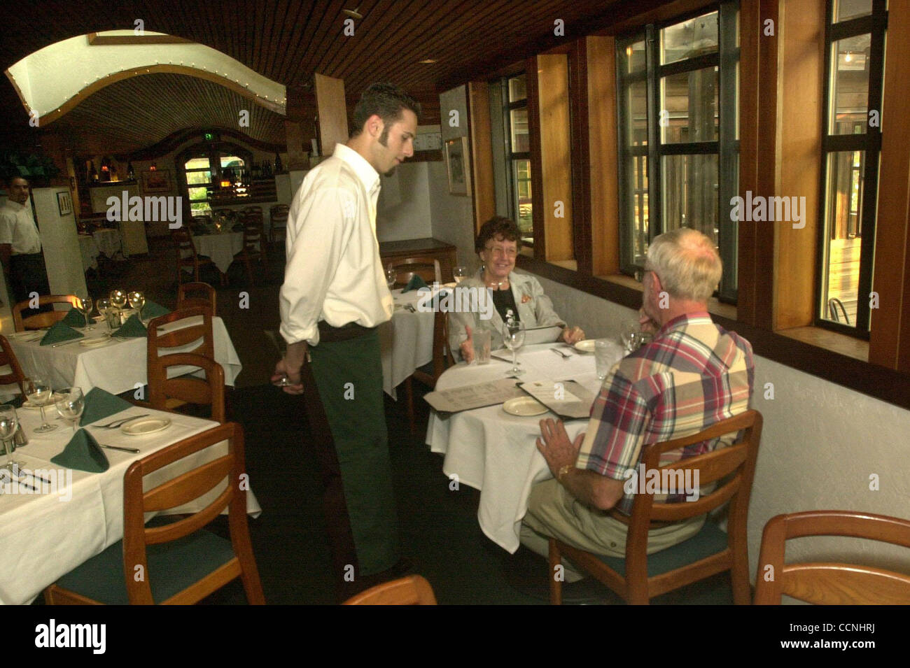 Waiter Adam Winchester of San Francisco, Calif., (left) talks to Norma ...