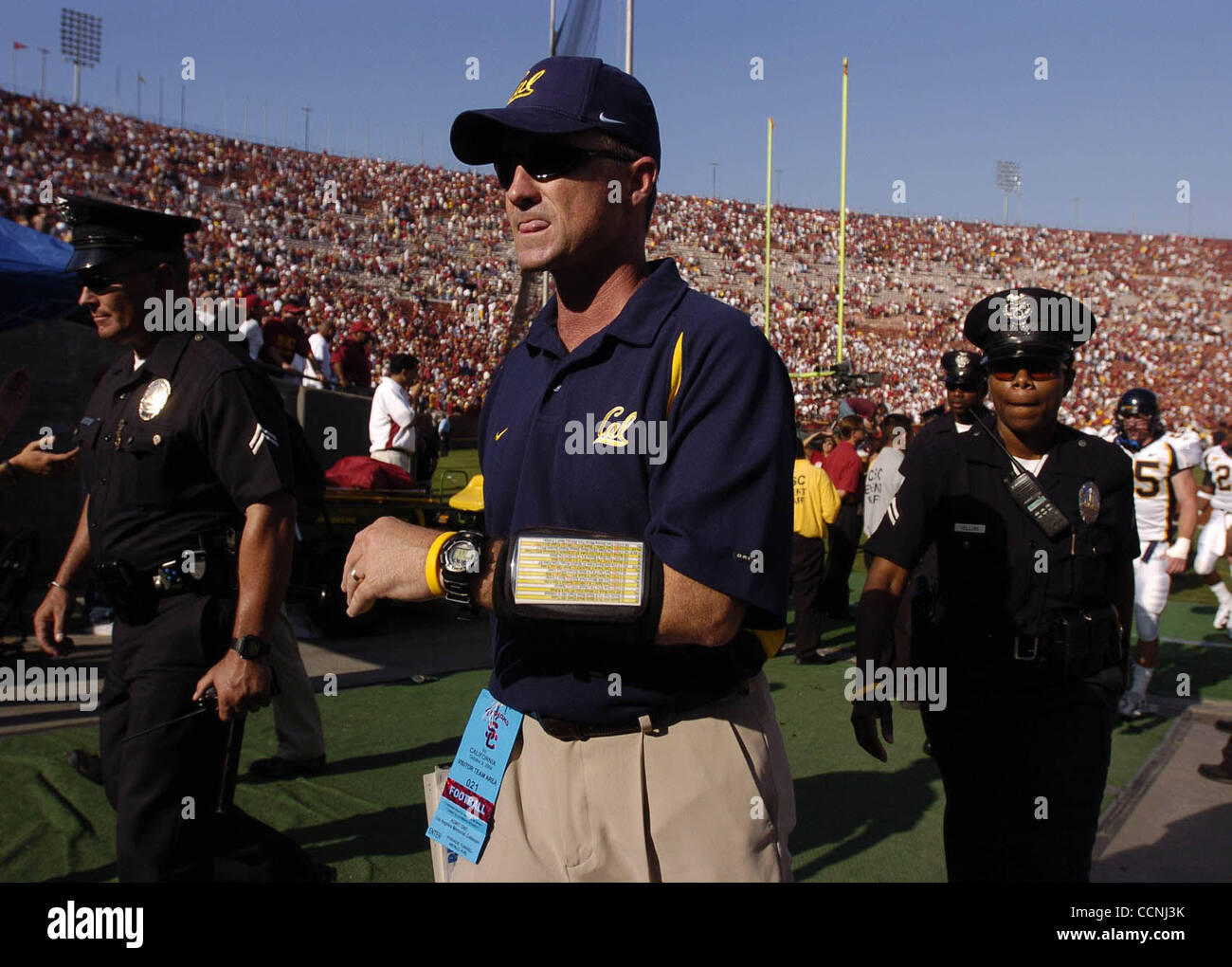 Cal's head coach Jeff Tedford walks off the field after losing to USC ...
