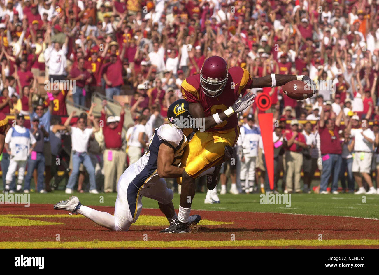 Cal's Ryan Gutierrez, #23, can't stop USC's Dwayne Jarrett, #8, from ...