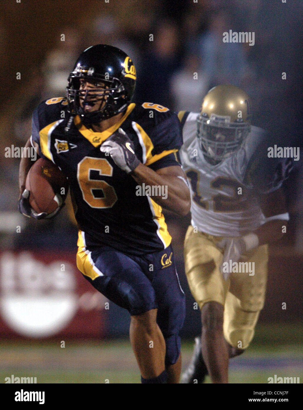Geoff McArthur takes off on an 80-yard touchdown pass play from Aaron ...