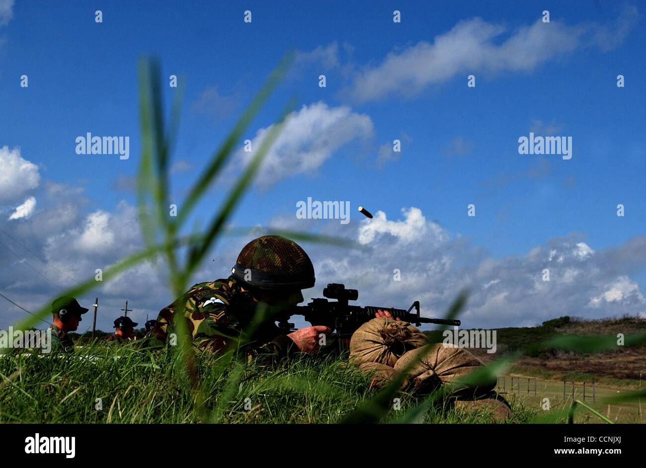 Corporal Tom Foskett of the Royal Air Force fires live ammunition from ...