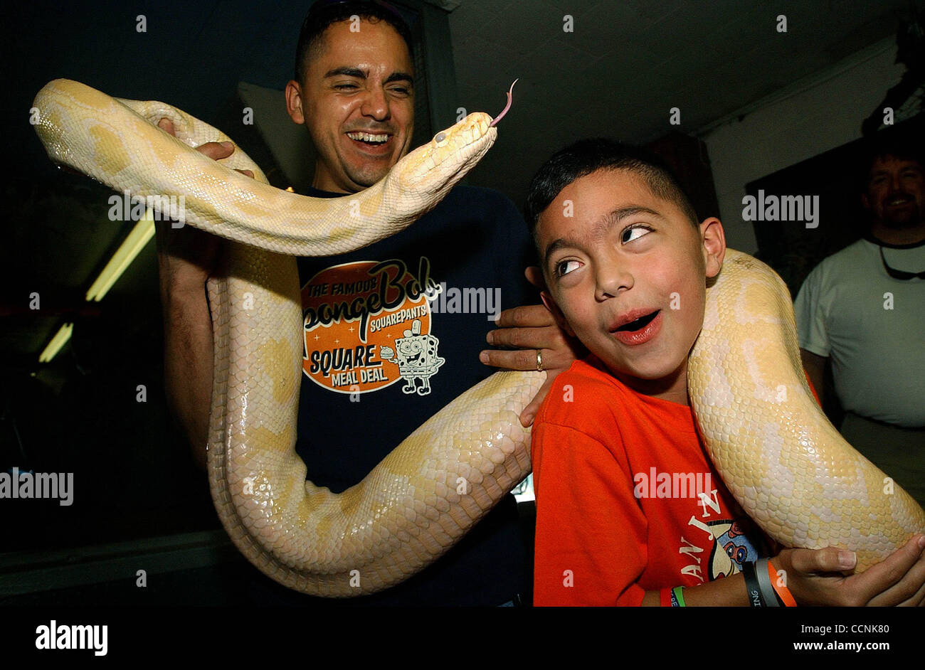 METRO Eight year old Adam Eli Camacho marvels as a large pyhton at ...