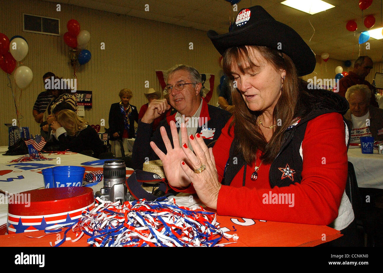 METRO Mary Ann Walsh gestures in prayer with her husband at the ...