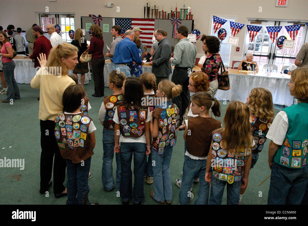 Girl Scout leader explains voting process to grade-school scouts ...