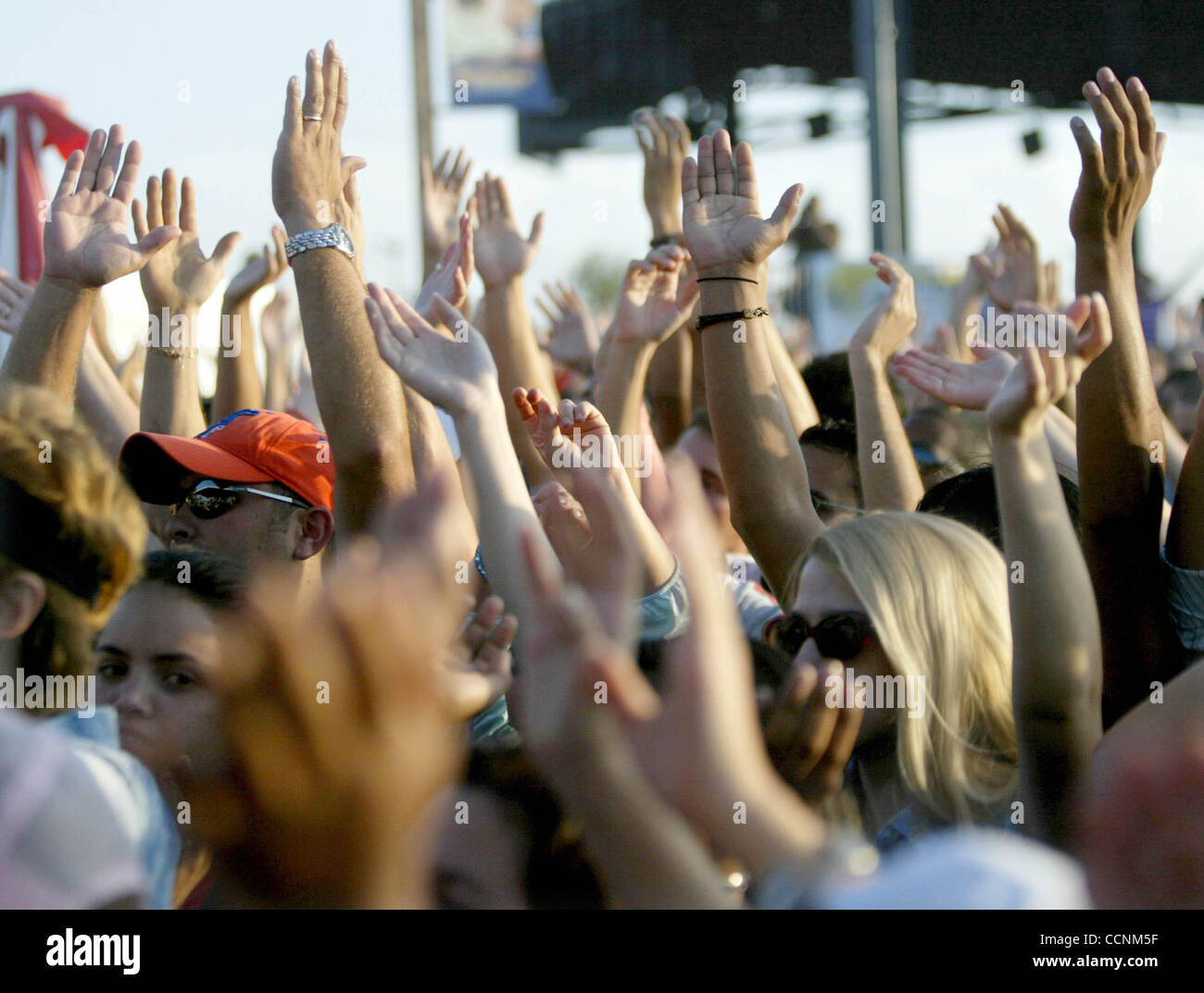 WEST PALM BEACH - Hundreds of Christian rock fans raise their hands as ...