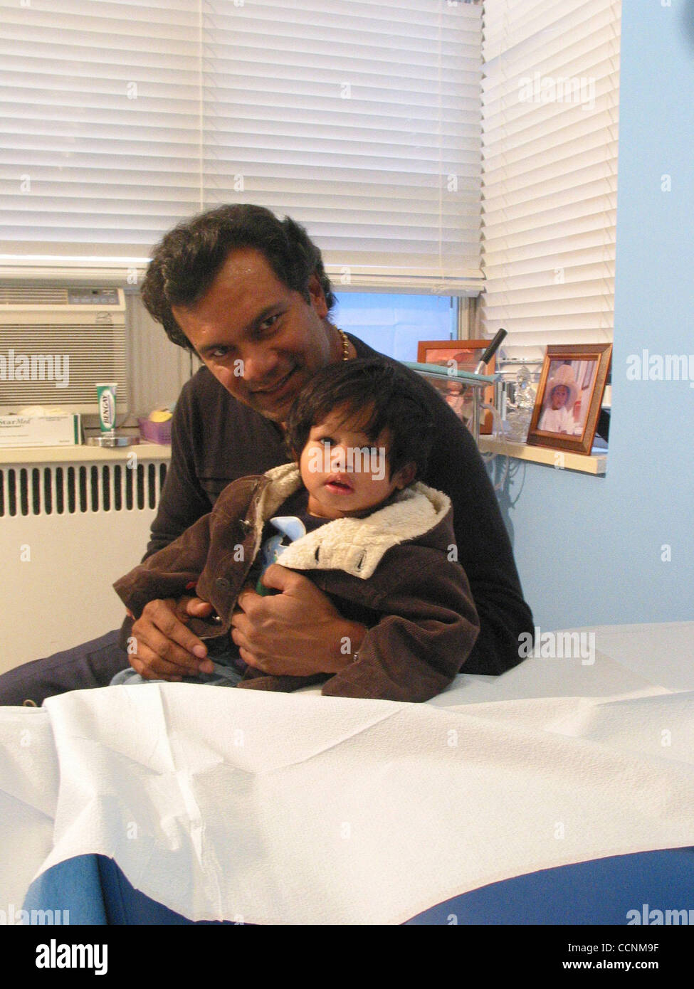 Photo released by Dr. Lionel Bissoon of he and his son William in his ...