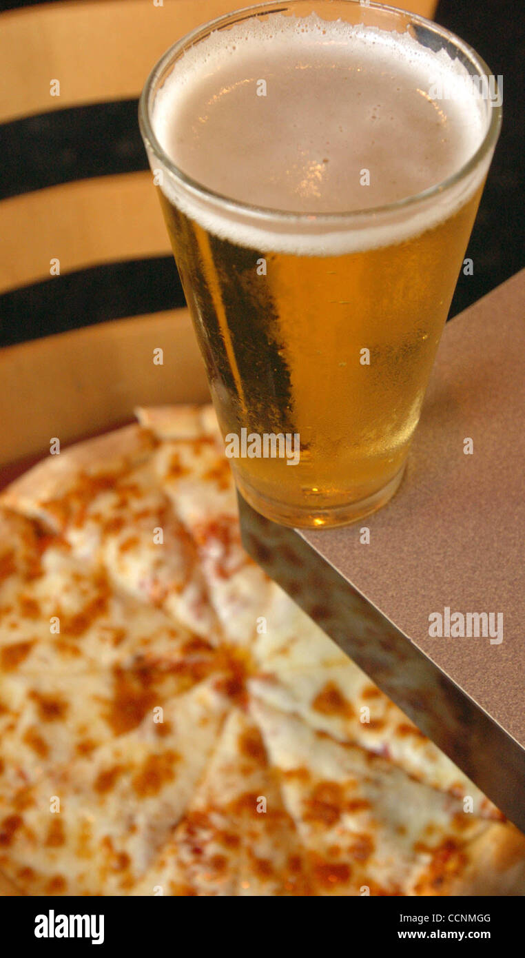 A cheese pie at Melo's pizza and pasta with a Bud on tap Tuesday ...