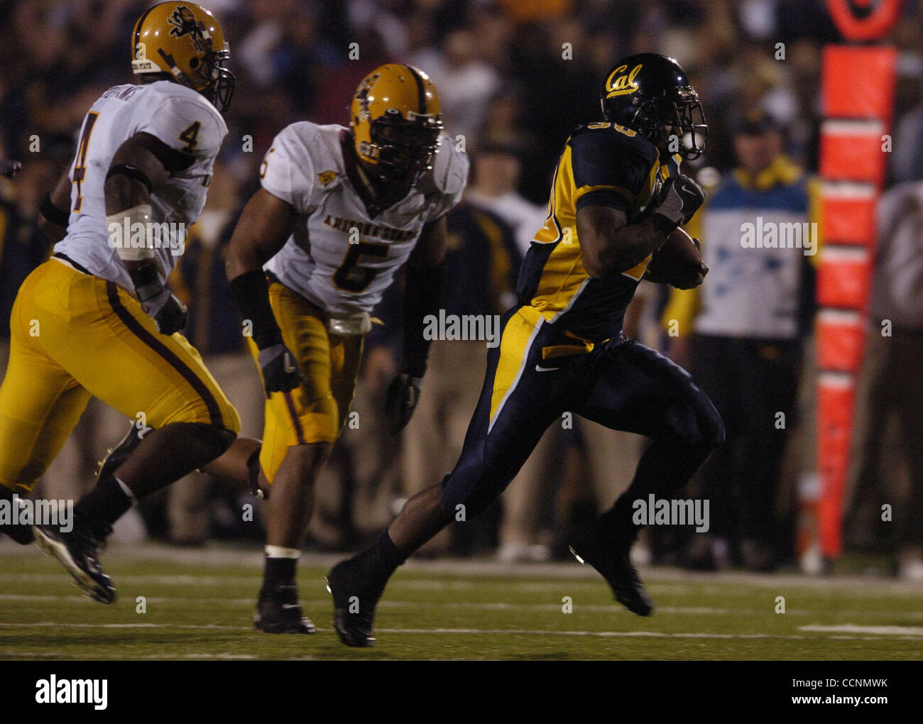 Cal's J.J. Arrington, #30, runs past Arizona State's Jamar Williams, #4 ...