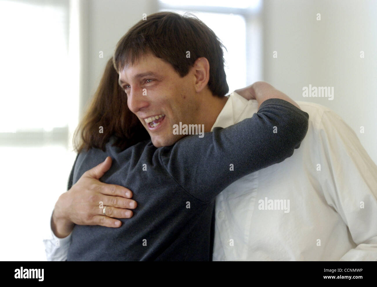 Simone Hernandez, from Orinda, shares a hug and a smile with Scott ...
