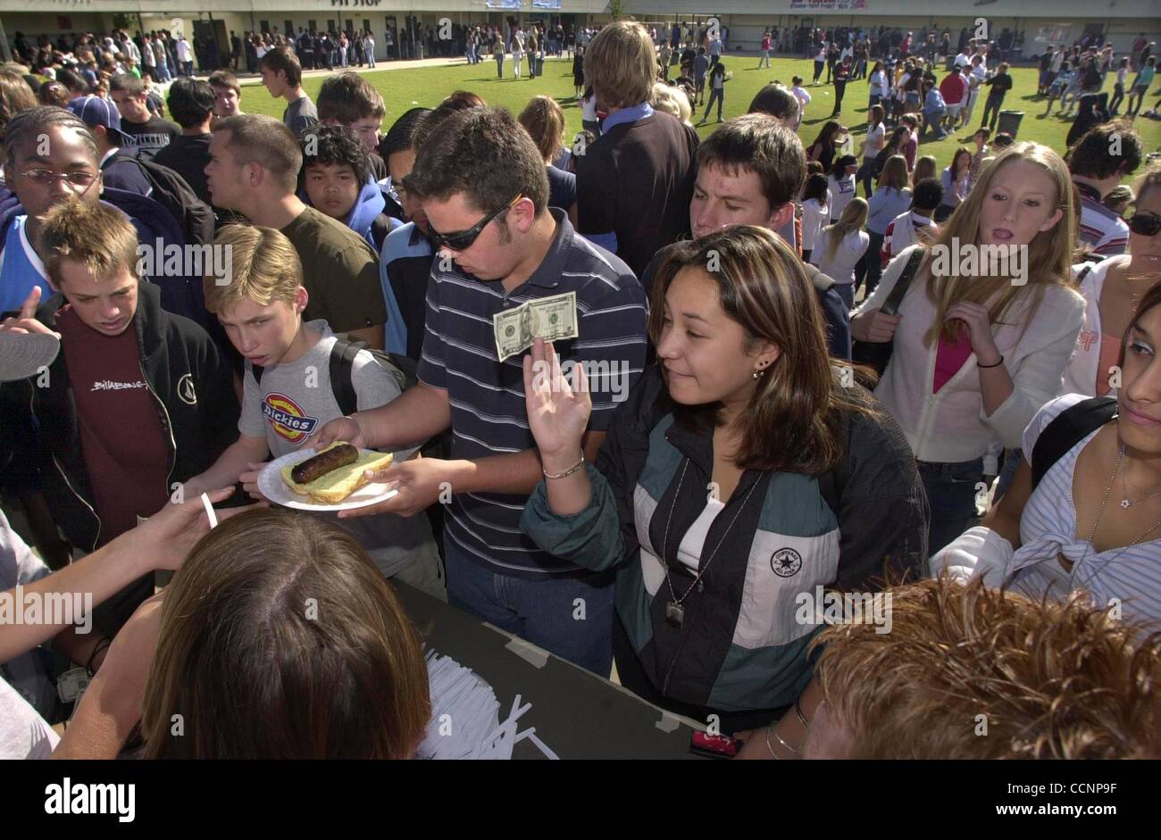 (Published on 12/17/204, NC-2, NI-2) DIANA ORTEGA holds her money up as ...