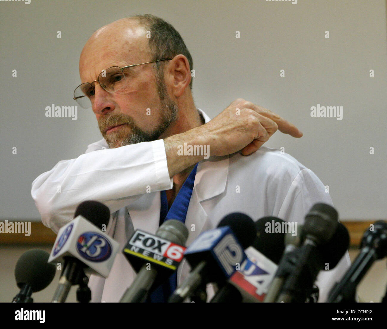 Dr. Lynn Koob decribes at a press conference how a bullet went in ...
