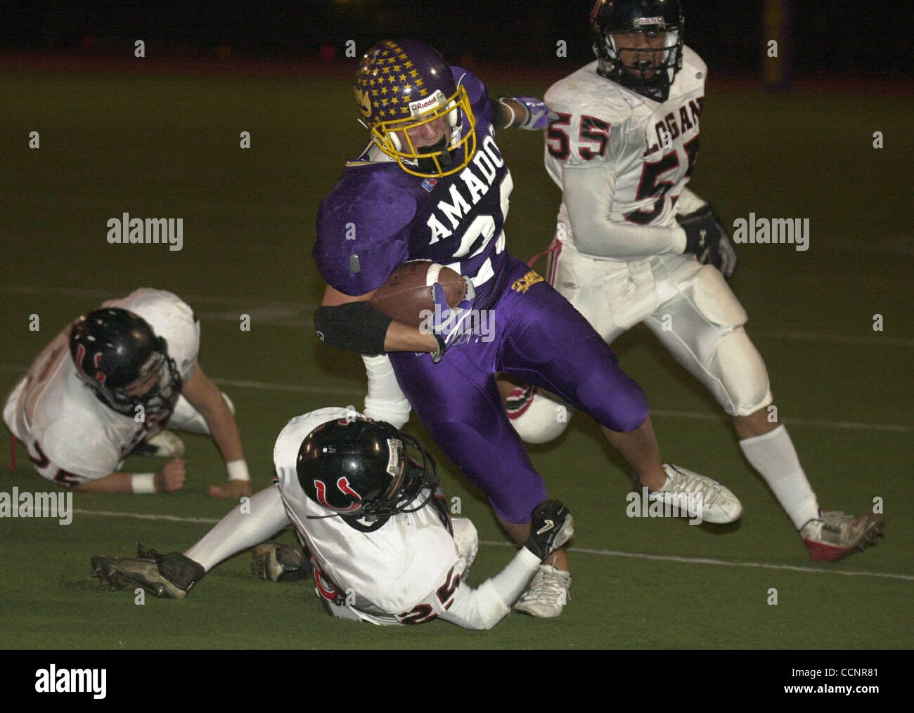 Amador Valley High's #20 Cory Guillory (center) tries to get past James ...