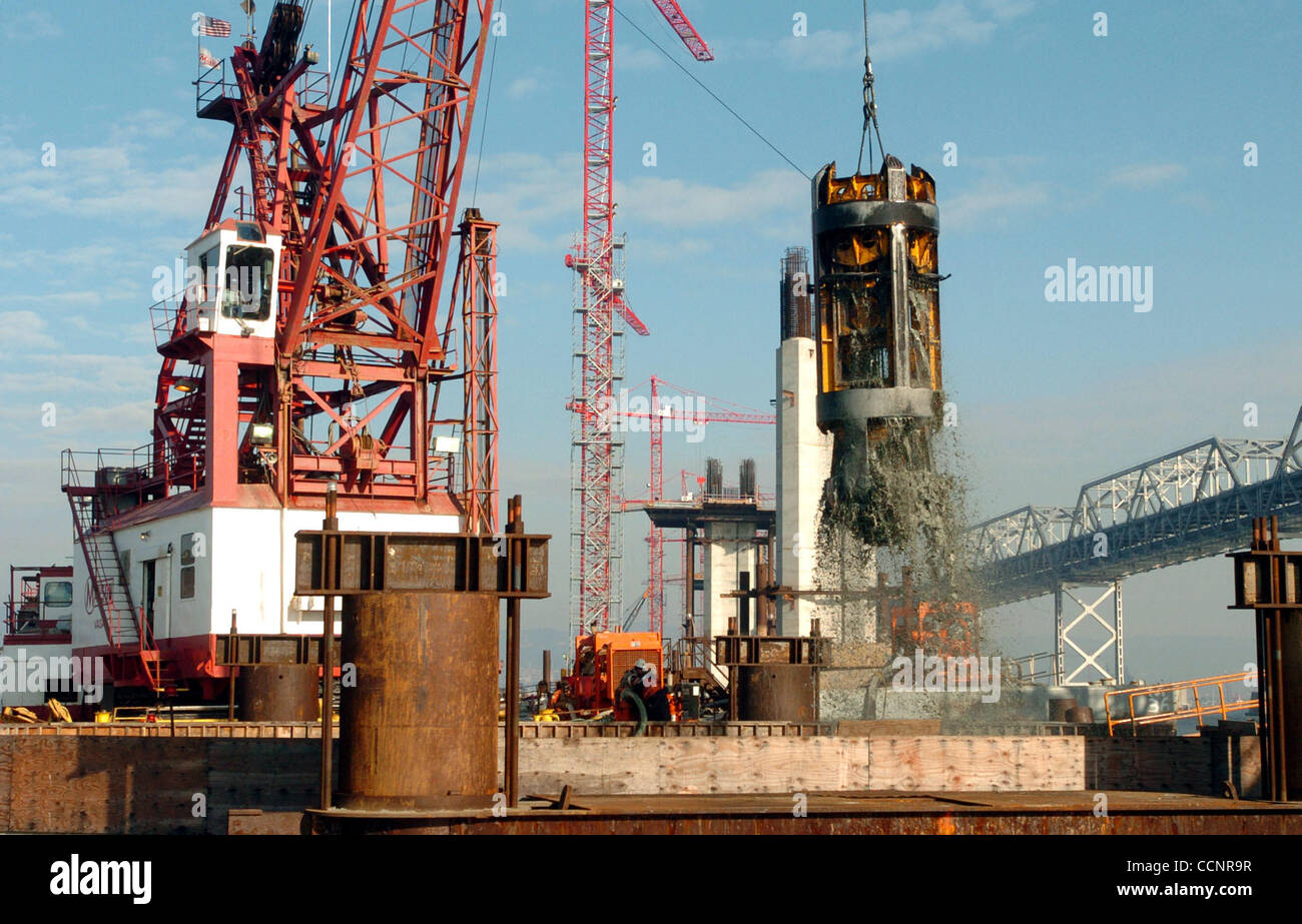 A huge, specially made 'clam jaw' cleans out a piling on pier 3 on ...