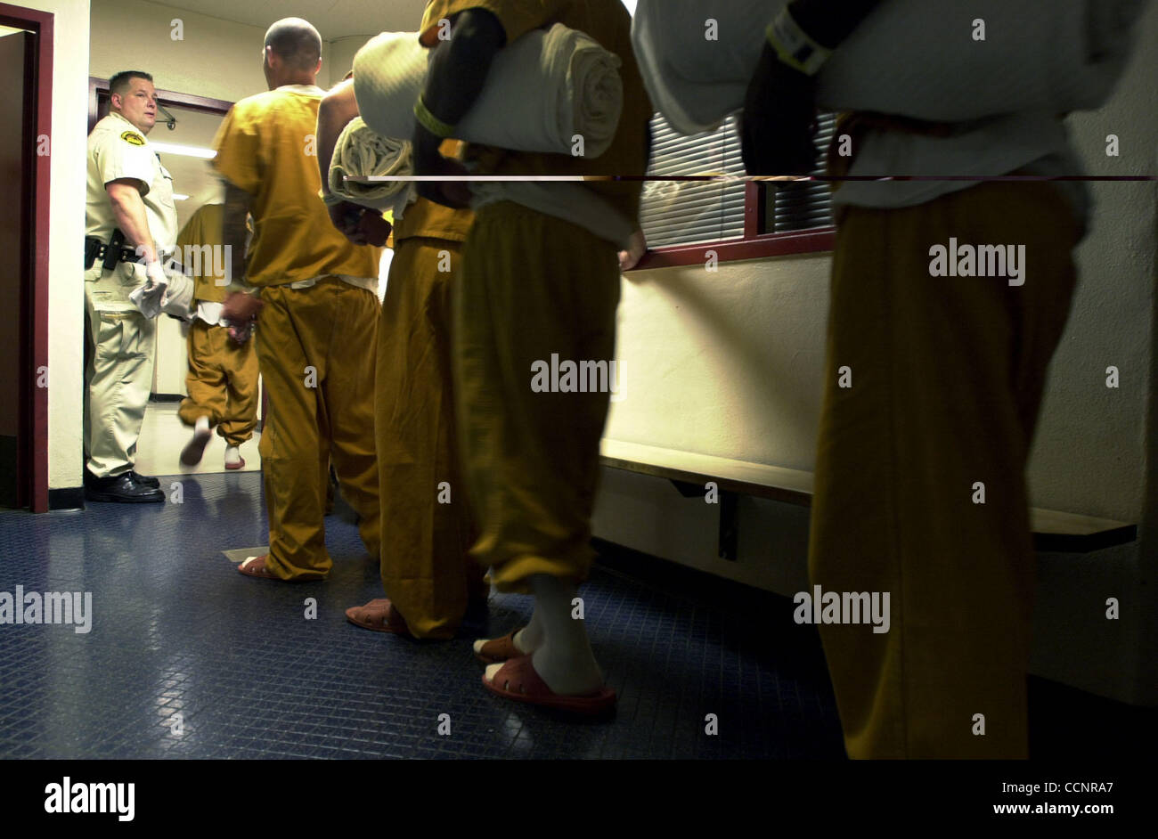 1:59 Sheriff's Deputy Wayne Engelstad holds the door for a group of ...