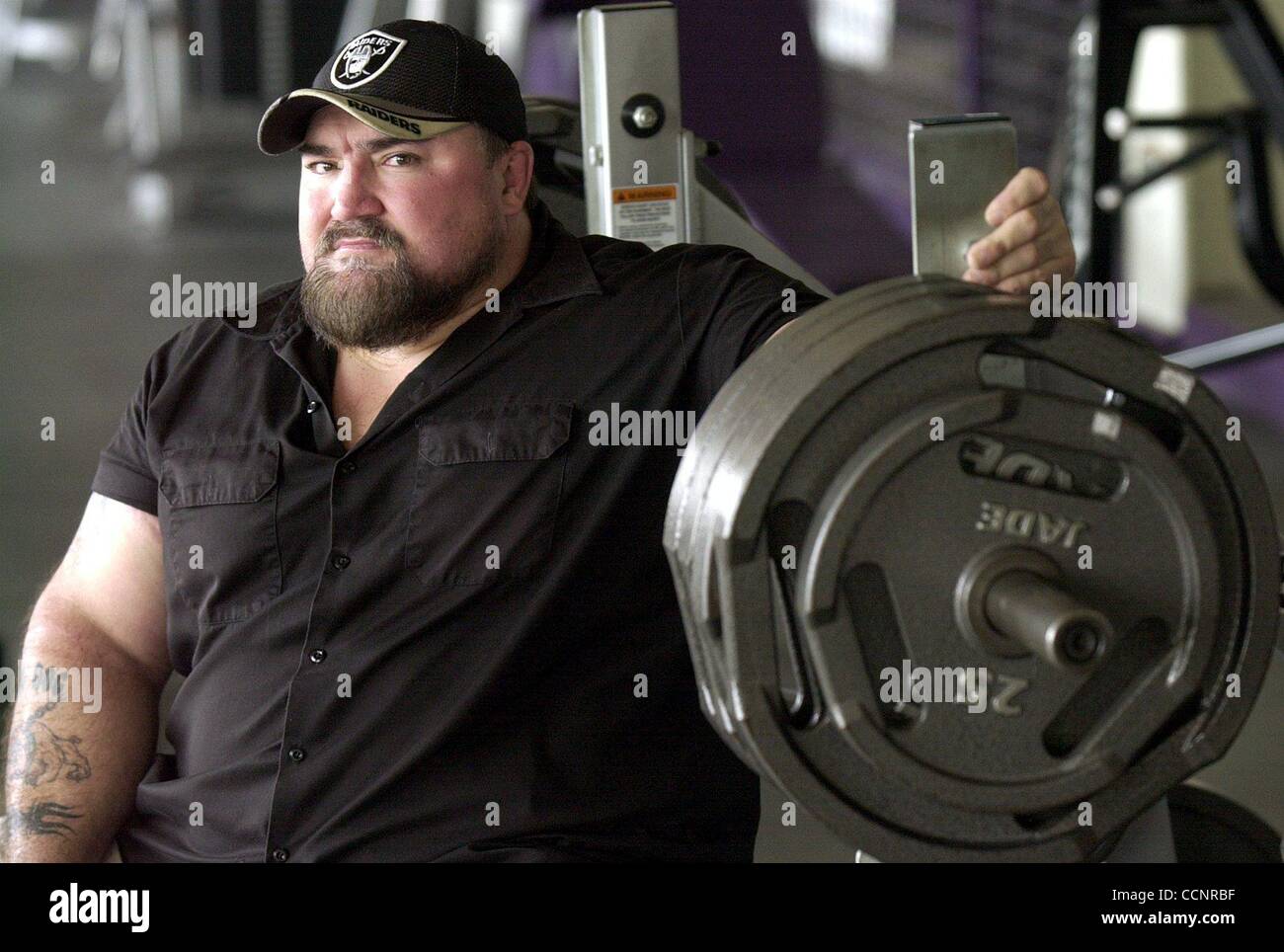 Art Ramsey, a power lifter, sits at the weight lifting bench at the ...