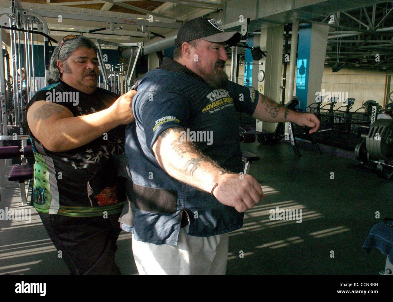 Tony Galena, who spots for Ramsey, helps Art Ramsey, a power lifter ...