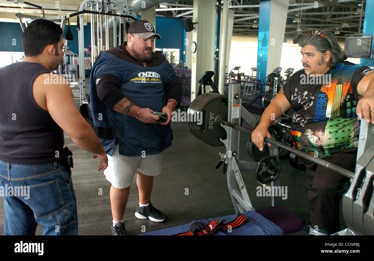 Art Ramsey (center), a power lifter, works out with (l to r) Bobby ...