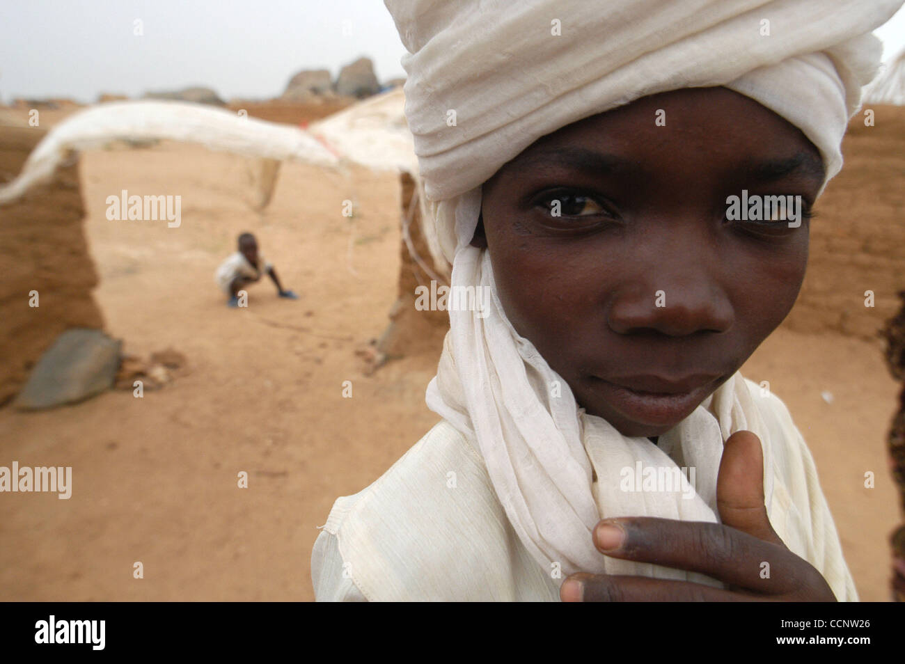 July 17, 2004, Abeche, Chad - A young boy from Darfur, dressed in ...