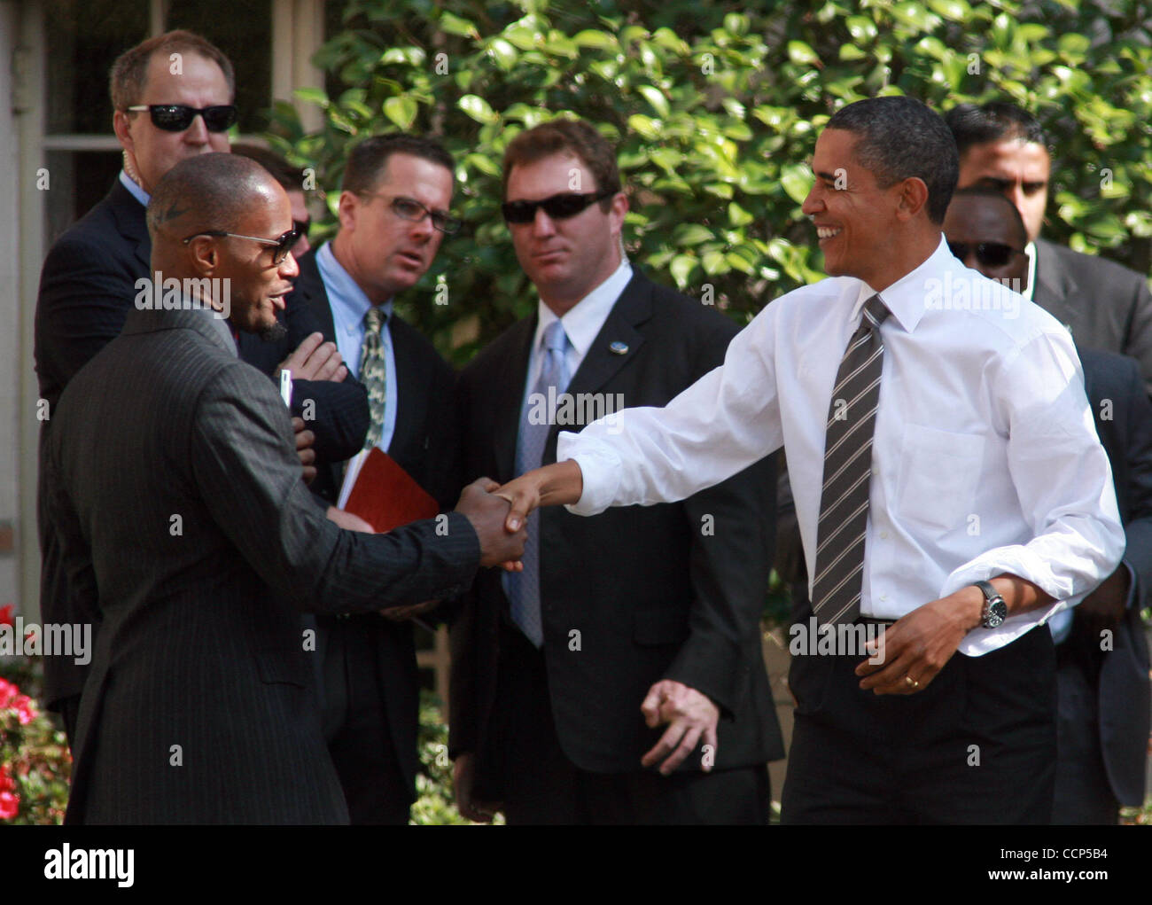 US President Barack Obama greets actor Jamie Foxx at a Moving America ...