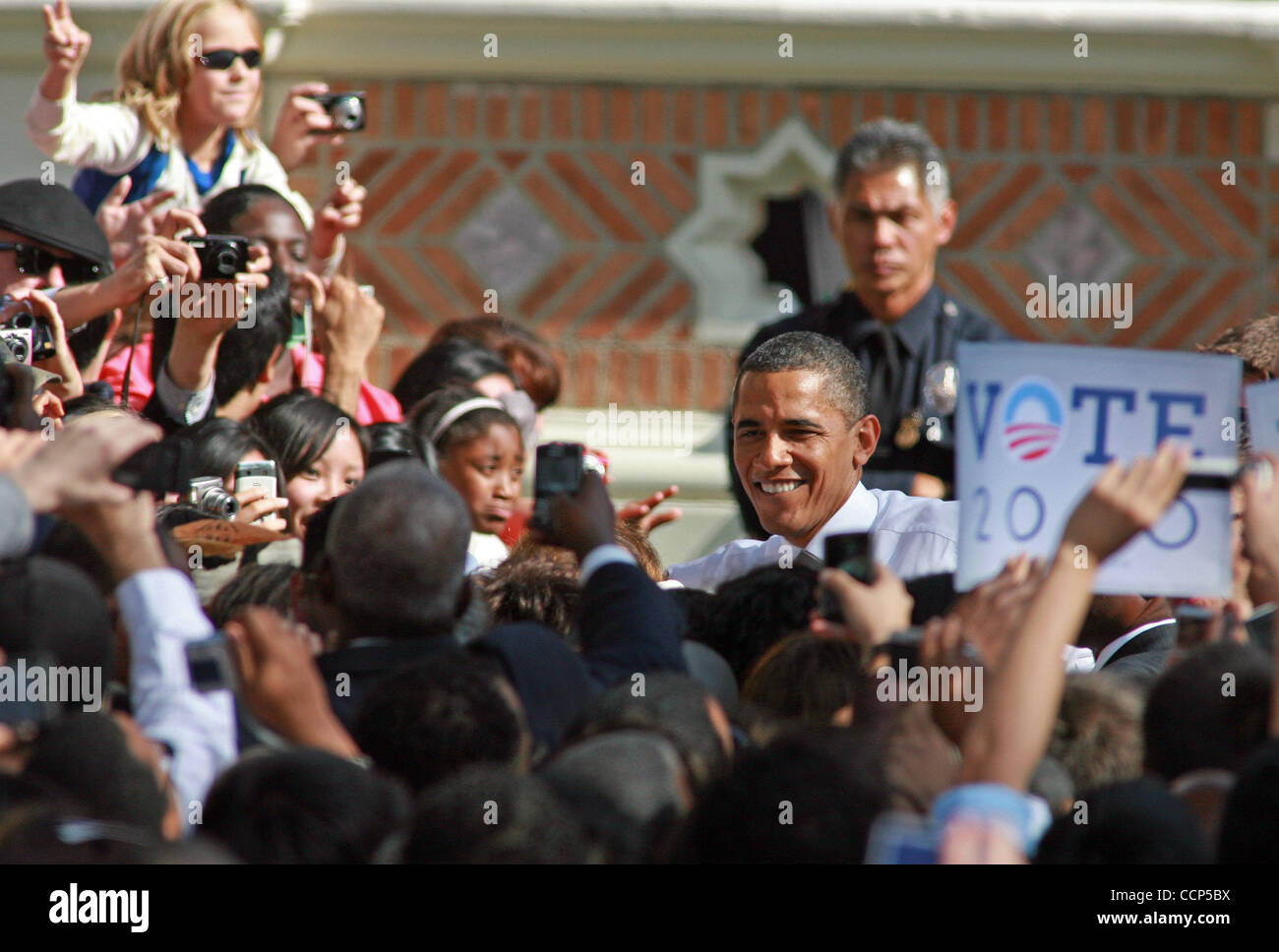 US President Barack Obama shakes hands with people after speaking at a ...