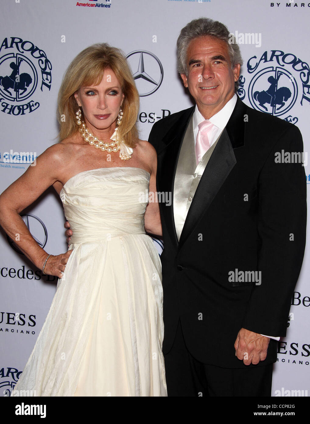 Donna Mills & Date arrives for the Carousel of Hope at the Beverly ...