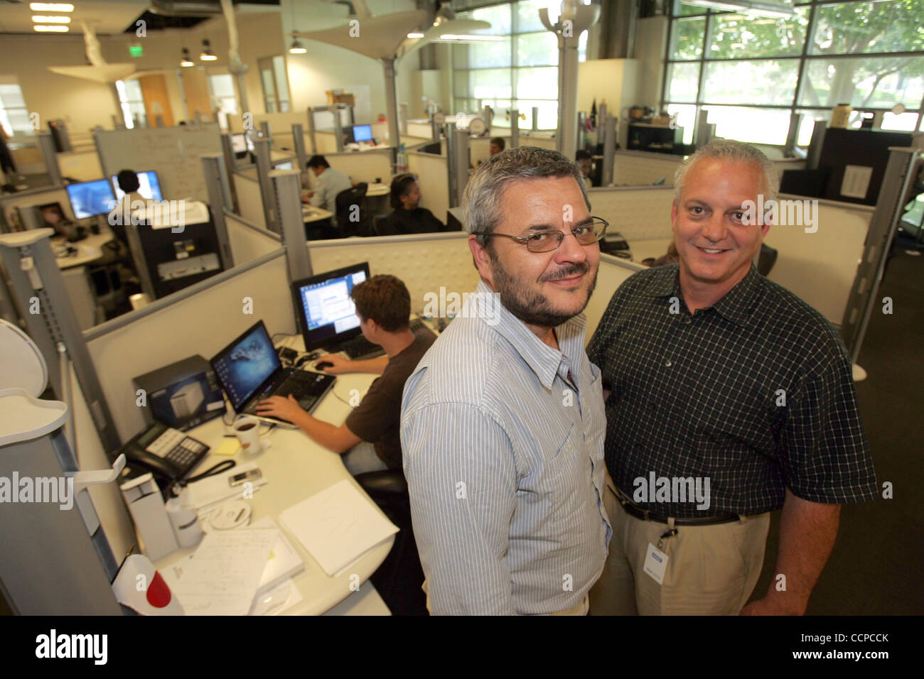 Mark Tapling (R) and Daniel Marcu of Language Weaver, a company started ...