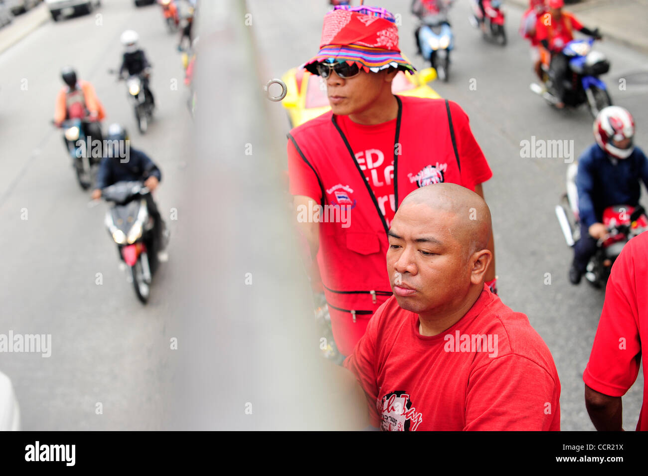 Red Shirts ride on a truck equipped with speaker system. Motorcade ...