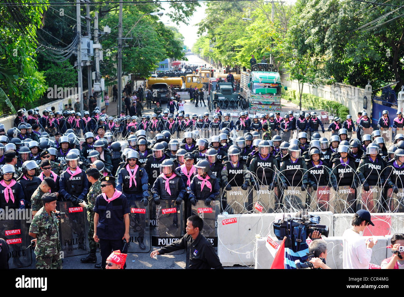 Police and Soldiers with full body riot gear behind fortification on ...