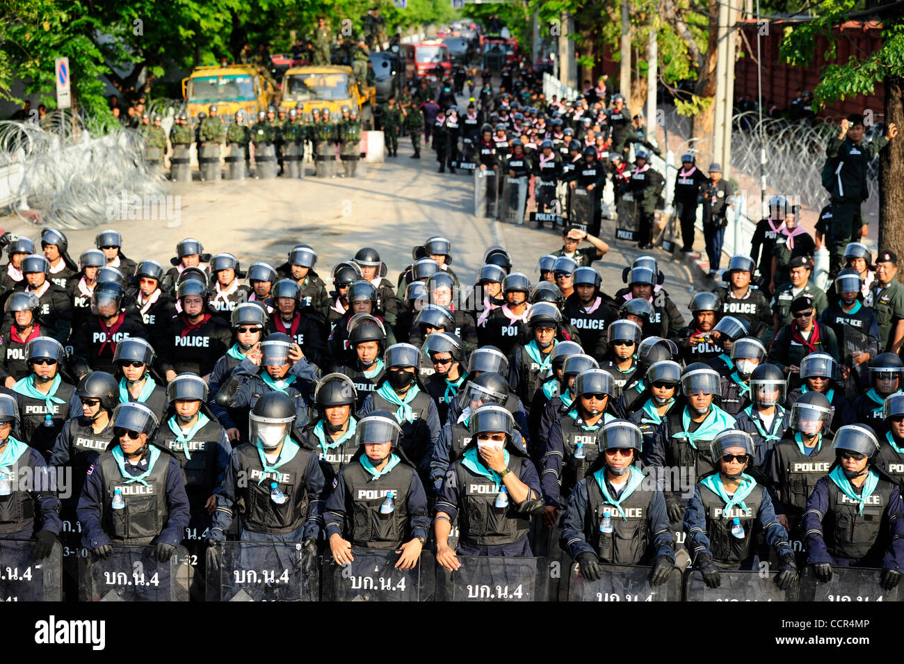 Police and Soldiers stand guard on one of a road which leads to ...