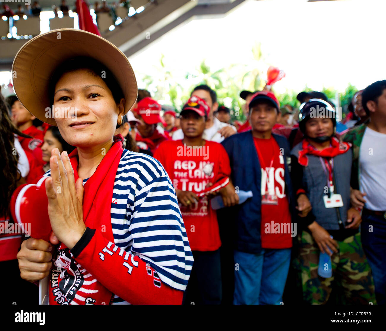 A Red Shirt with clapper in her hand near protest site in central ...