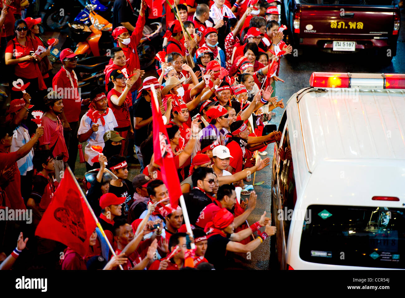 Red Shirts wave at police motorcade as they leave the protest site in ...