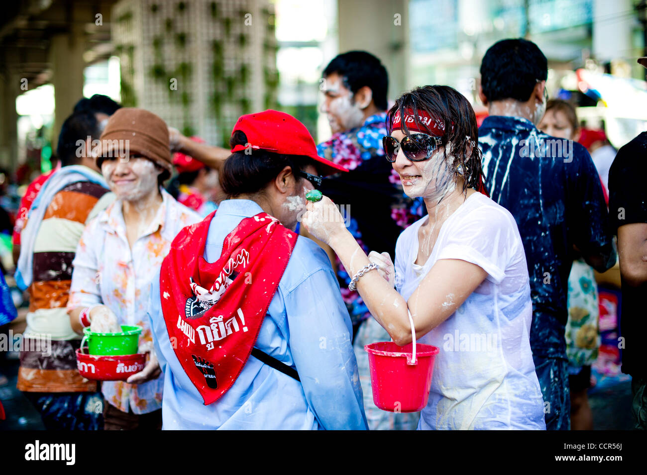 Red Shirts and tourist celebrates Songkran festival at Ratchaprasong ...