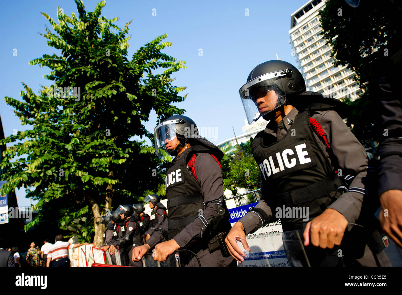 Thai riot police stand guard in front of Dusit Hotel at Silom District ...