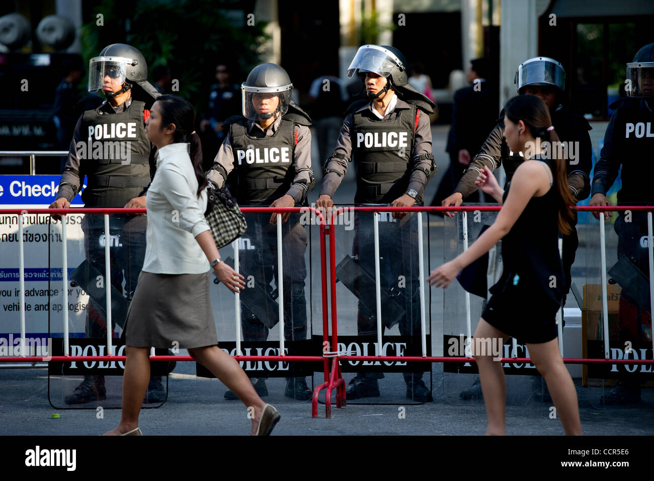 Thai riot police stand guard in front of Dusit Hotel at Silom District ...