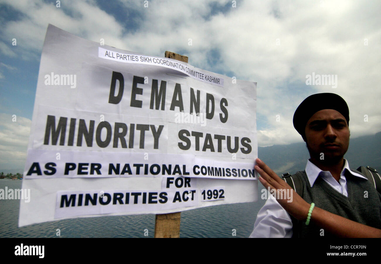 Kashmiri Sikhs holding placards during a demonstration on the banks of ...