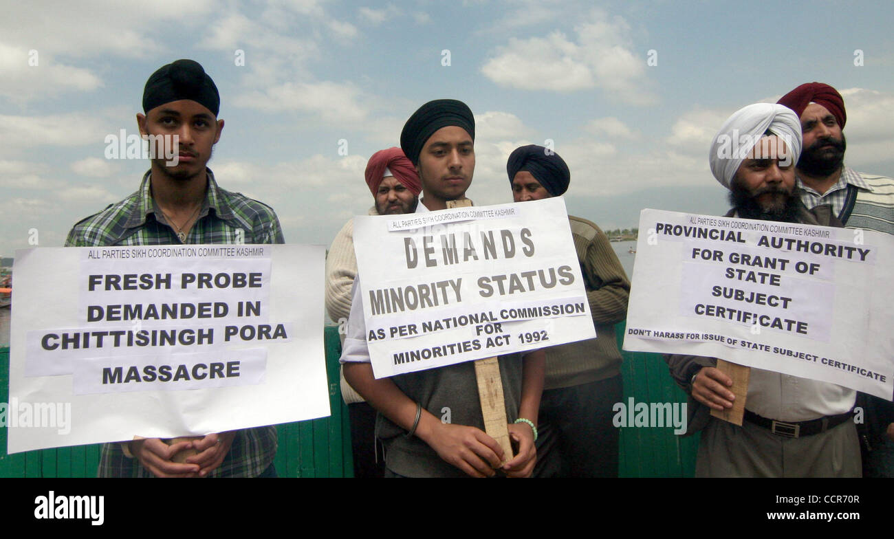 Kashmiri Sikhs holding placards during a demonstration on the banks of ...