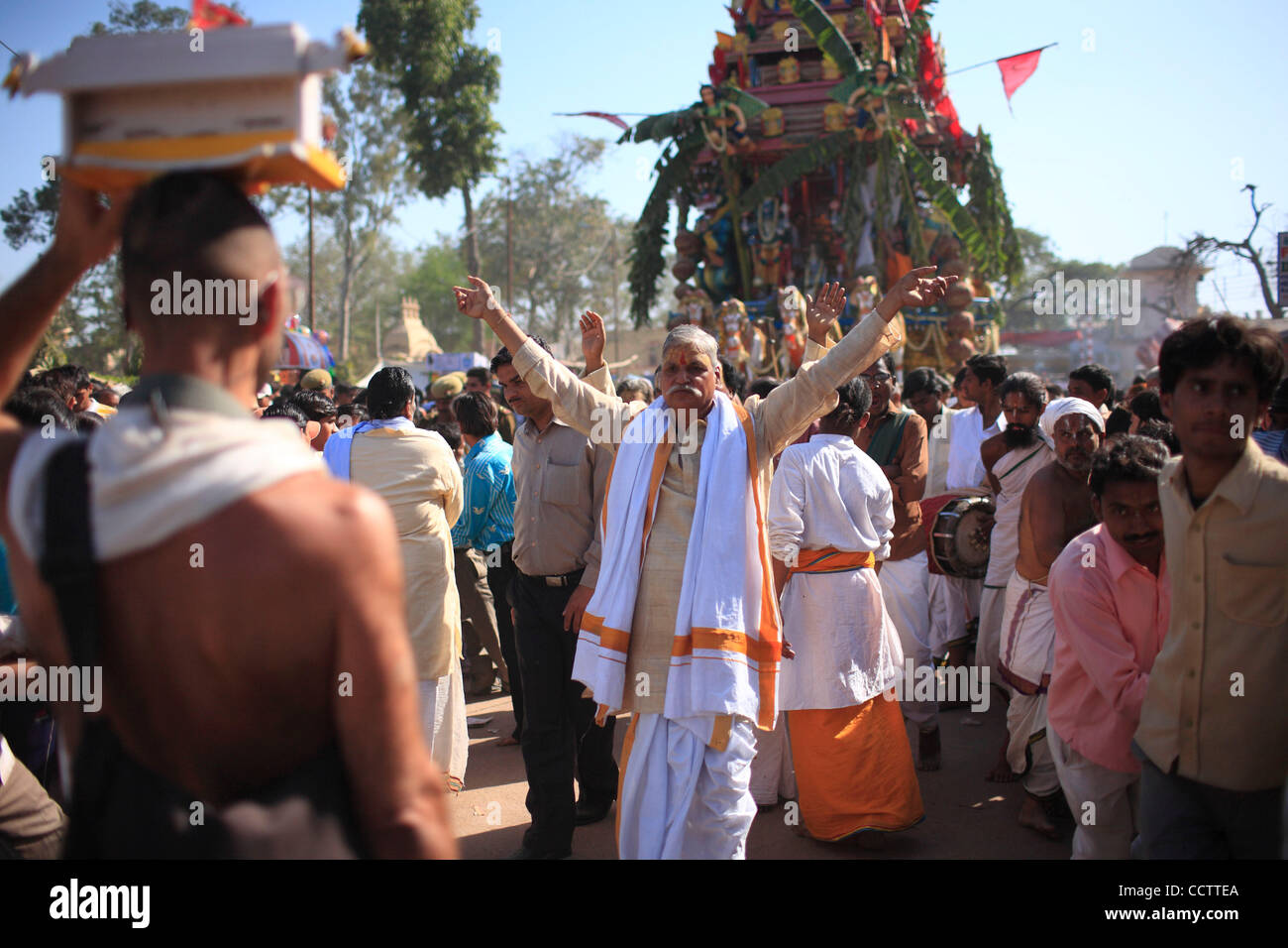 A Krishna devotee participates in a religious procession at Vrindavan ...