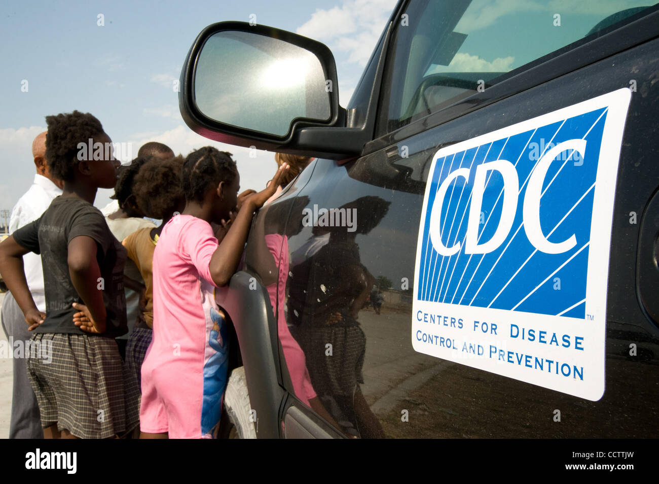 February 21, 2010, Port au Prince, Haiti - Children crowd CDC staff ...